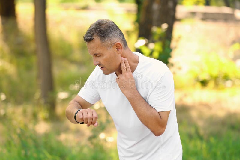 Man Checking Pulse Outdoors Stock Image - Image of male, jogger: 123862139