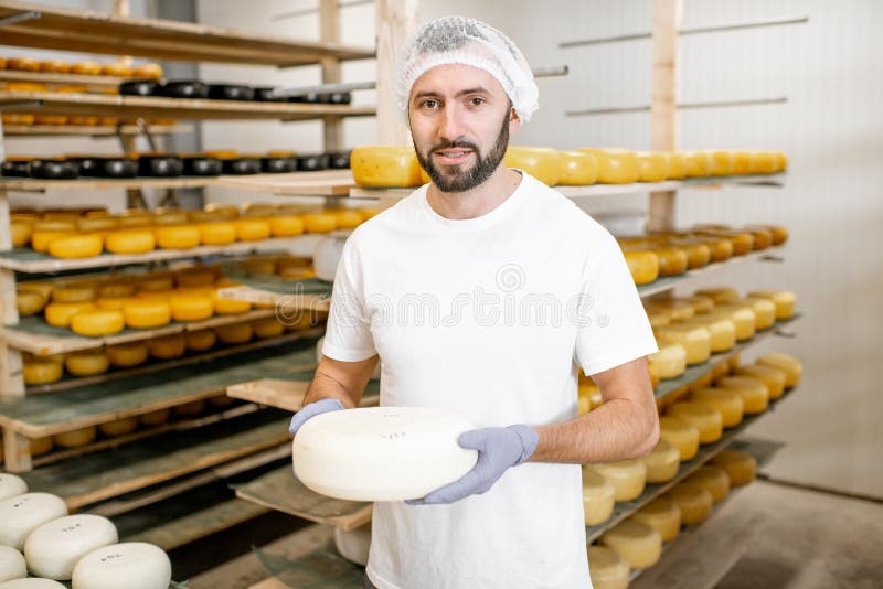 Man with Cheese Wheels at the Storage Stock Photo - Image of white ...