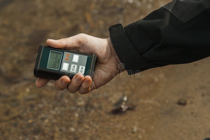 Man Checking Radiation With Geiger Machine Stock Photo - Image of hand ...
