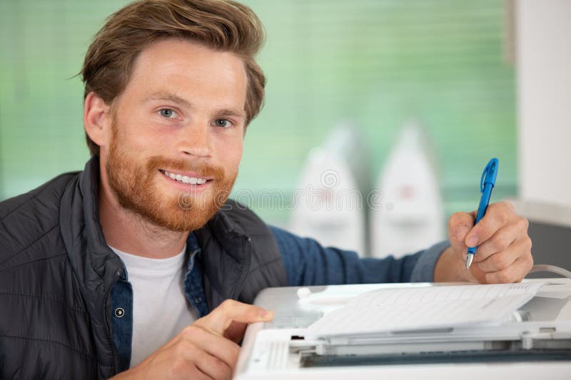 Man Checking Schedule in Office Stock Photo - Image of information ...