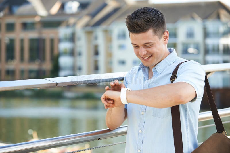 Man Checking Smart Watch Whilst Walking To Work Stock Image - Image of ...