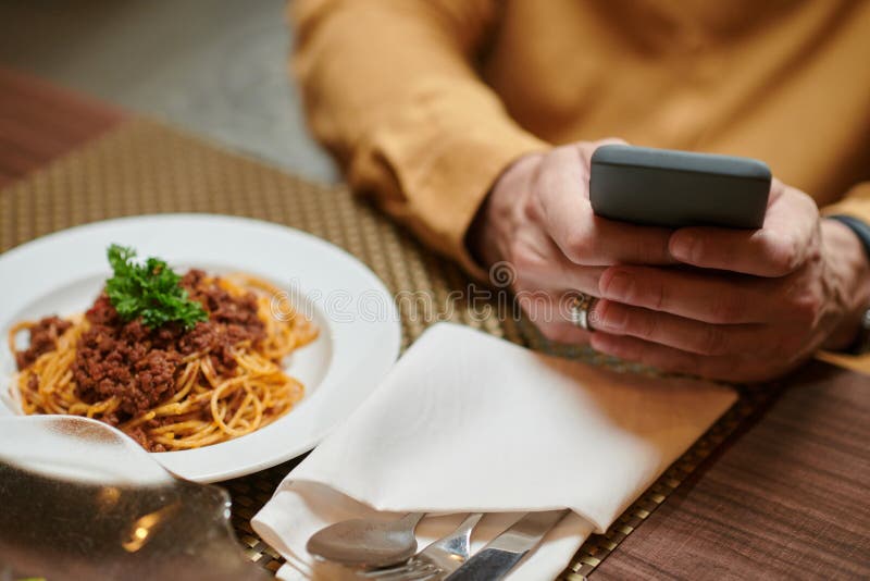 Man Checking Smartphone stock photo. Image of dinner - 266432830