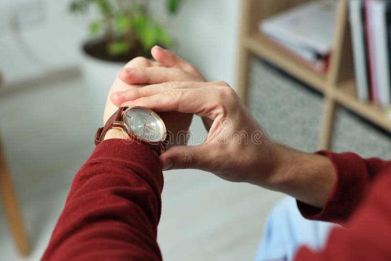 Man Checking Time in Room, Closeup. Being Late Stock Photo - Image of ...