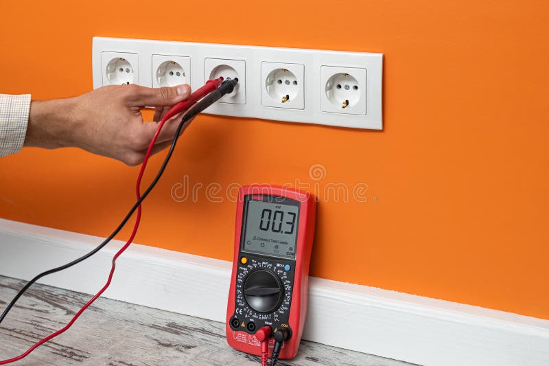 Checking the Voltage of Electricity at a Home Outlet Stock Image ...