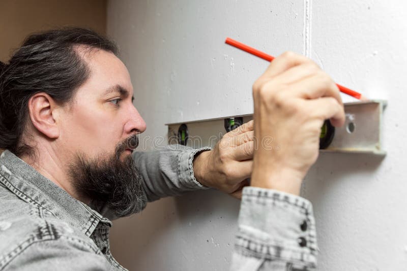Man Checking Wall with a Level Stock Image - Image of carpentry, plan ...