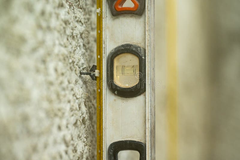 A Man Checks the Attached Guide Beacon for Equality with a Level ...