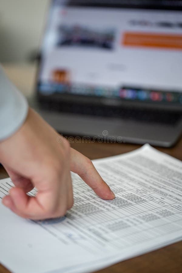 A Man Checks Documents with His Finger. Stock Image - Image of ...