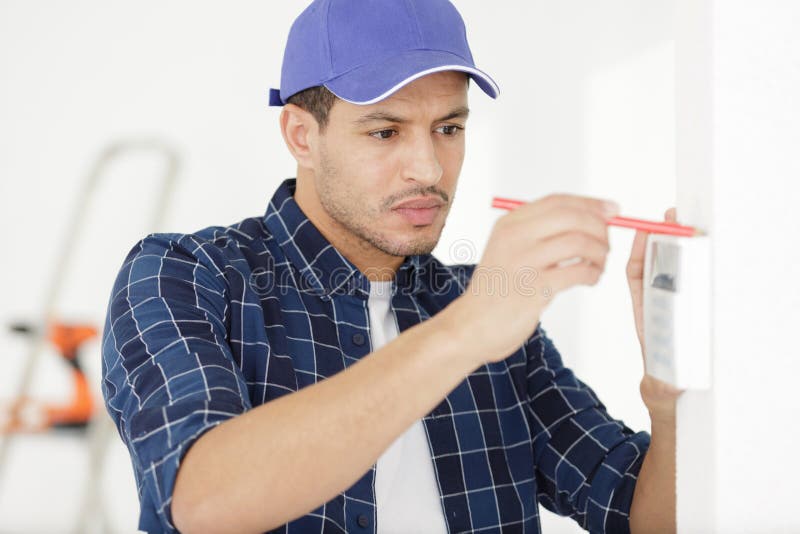 Man Checks Level and Appearance Wall Stock Image - Image of digit ...