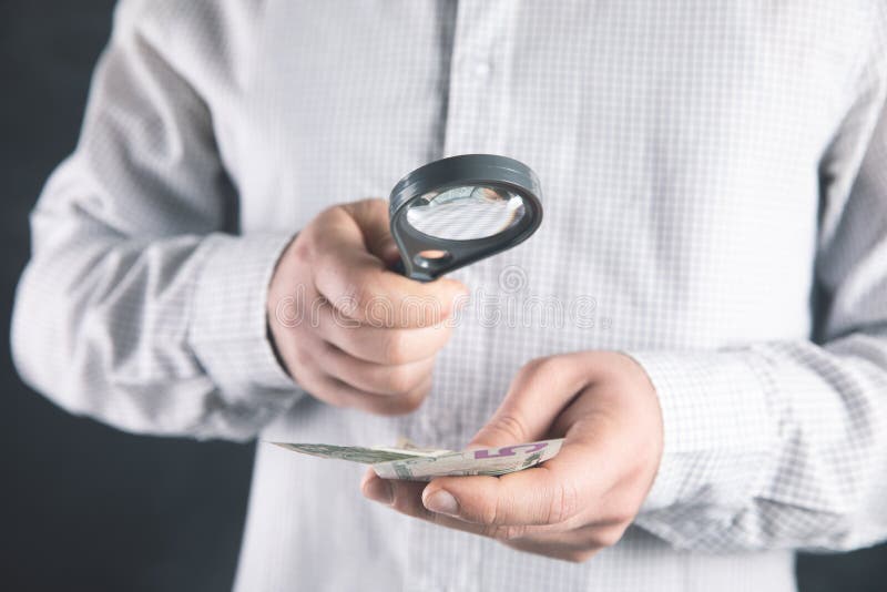 Man Checks Money with a Magnifying Glass Stock Photo - Image of ideas ...