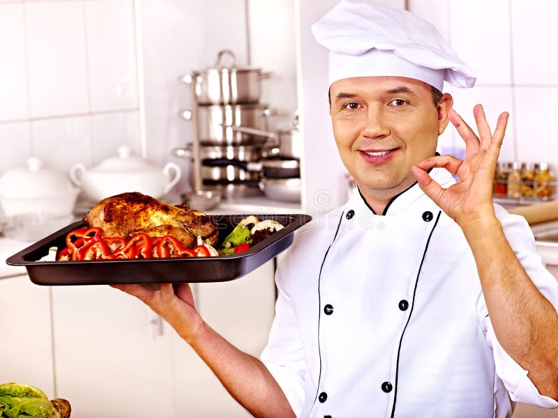 Man in Chef Hat Cooking Chicken Stock Photo - Image of handsome, mature ...