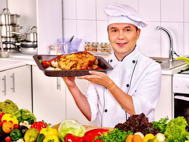 Man in Chef Hat Cooking Chicken Stock Image - Image of kitchen, cooking ...