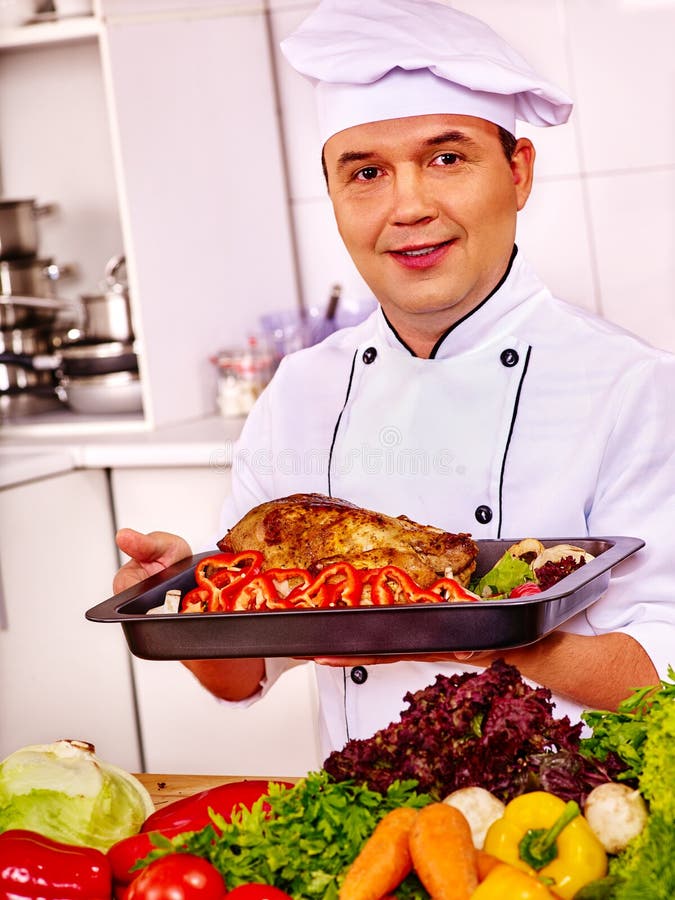 Man in Chef Hat Cooking Chicken Stock Photo - Image of handsome ...