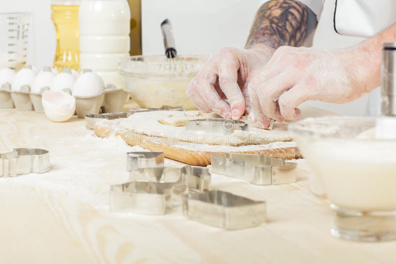 Man Chef in Uniform Makes Cookies with Baking Forms Stock Photo - Image ...