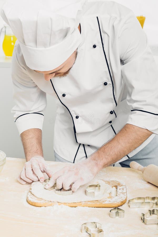 Man Chef in Uniform Makes Cookies with Baking Forms Stock Image - Image ...
