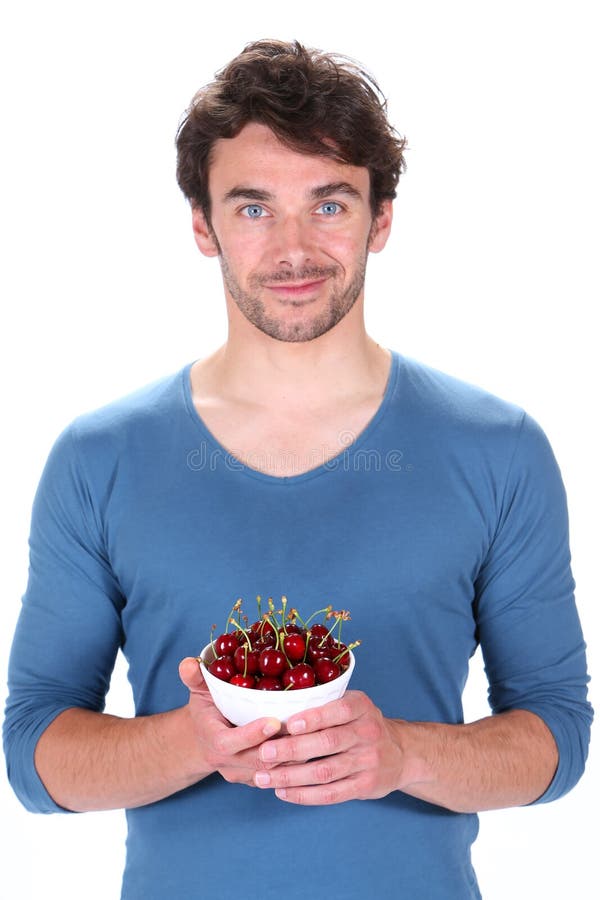 Man eating cherries stock image. Image of chew, brown - 34039619