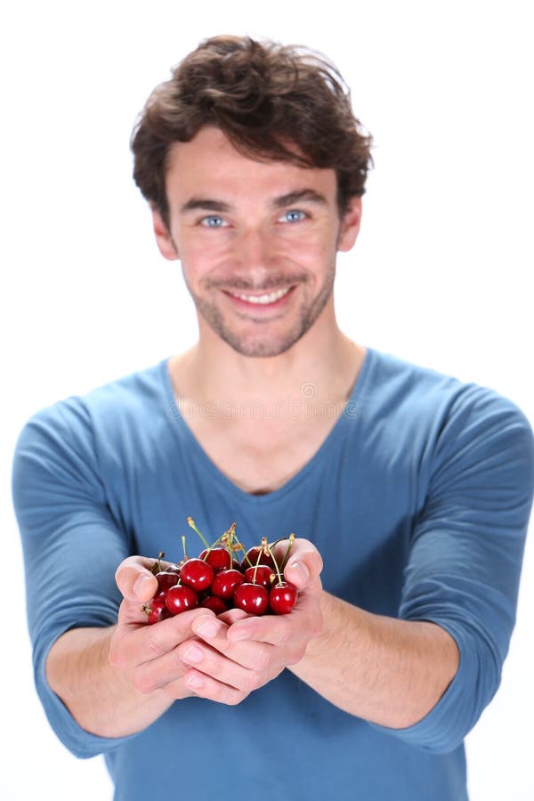 Man eating cherries stock image. Image of chew, brown - 34039619