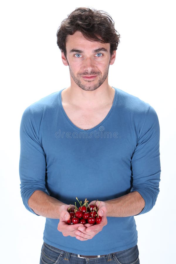 Man eating cherries stock image. Image of chew, brown - 34039619