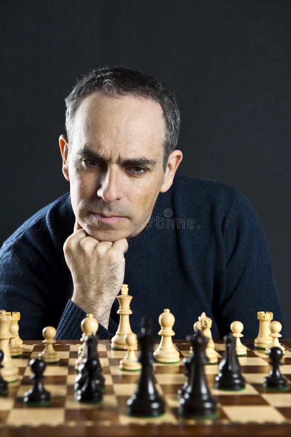 Man at chess board stock image. Image of pensive, competitor - 13992533