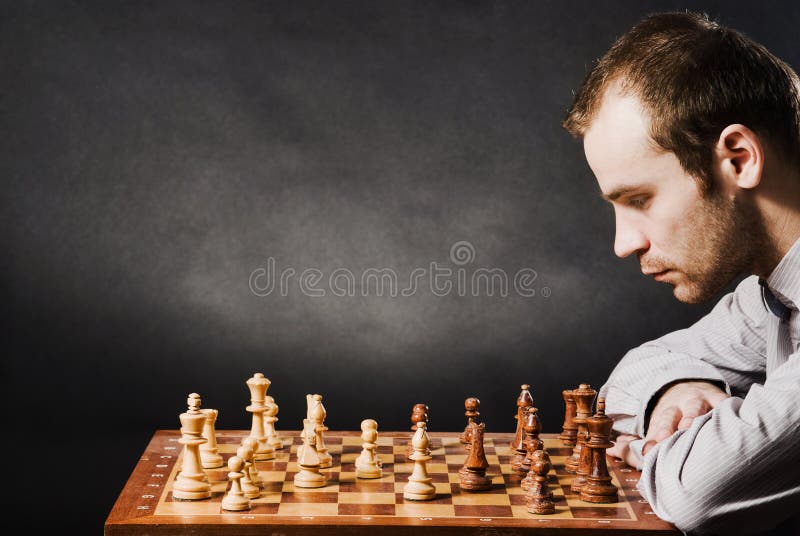 Man at chess board stock photo. Image of competition - 23587144