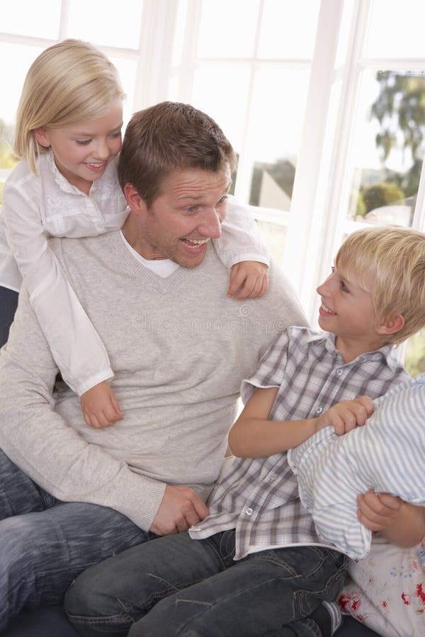 Man and Children Play Together Stock Photo - Image of father, daughter ...