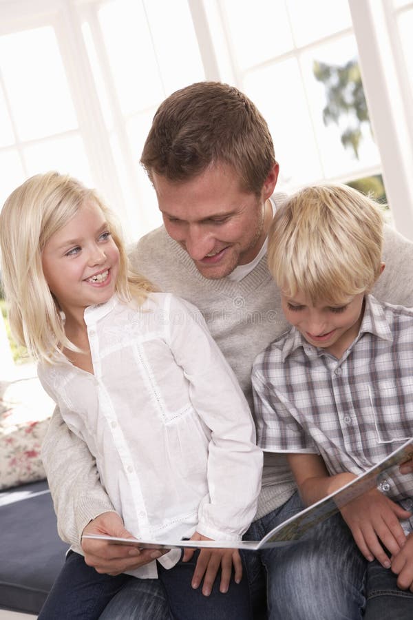 Man and Children Reading Together Stock Photo - Image of daughter ...