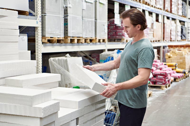 Man Chooses and Buys Foam Concrete Bricks in Store Stock Image - Image ...