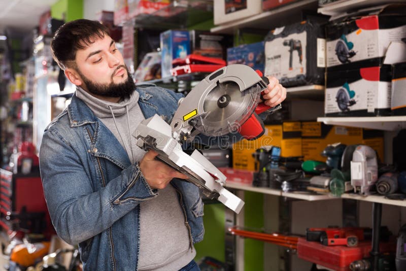Man Chooses Circular Saw in Tool Store Stock Photo - Image of ...
