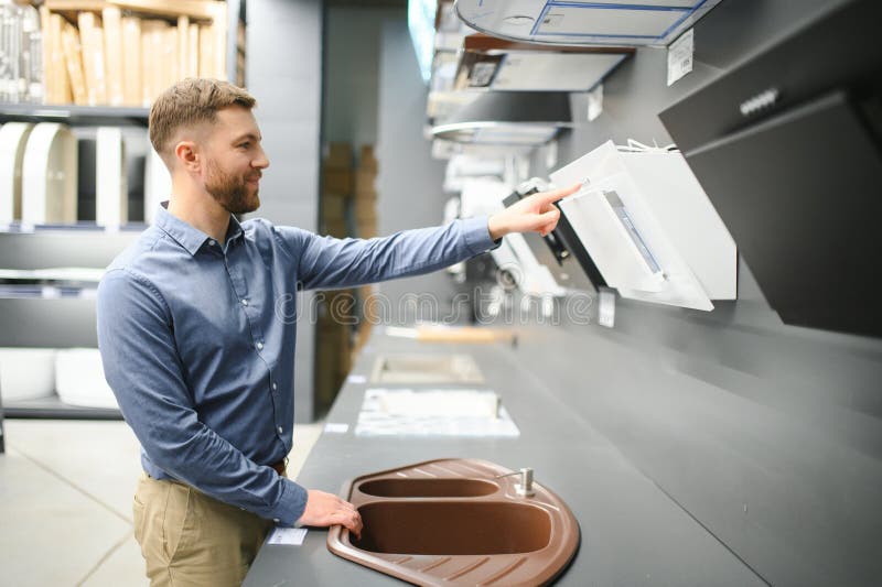 A Man Chooses a Cooker Hood in a Store Stock Image - Image of food ...