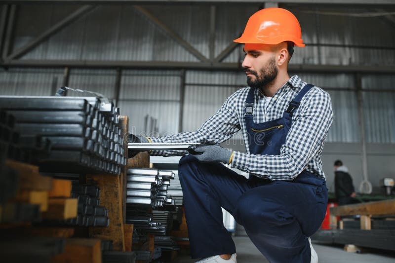 Man Chooses Metal Profile for Construction in Factory Stock Photo ...