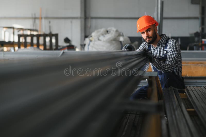 Man Chooses Metal Profile for Construction in Factory Stock Photo ...