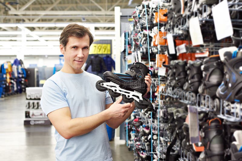 Man Chooses Roller Skates in Sports Shop Stock Image - Image of roller ...