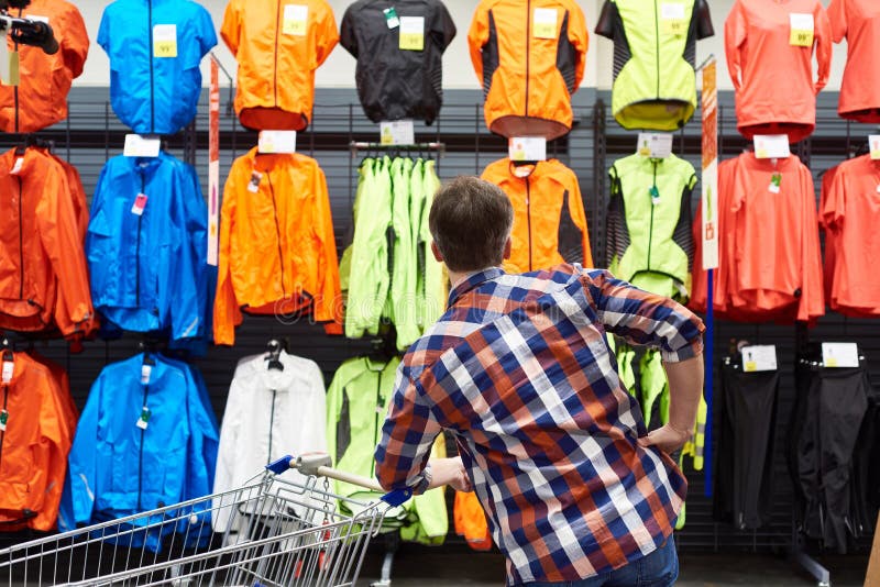 Man Chooses Sports Clothes in Store Stock Image - Image of selection ...