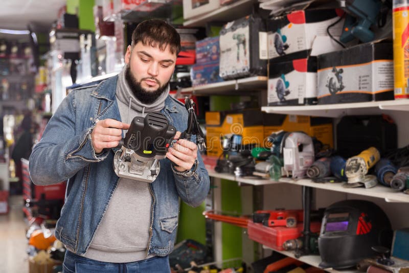 Man Chooses Wood Router in Store Stock Photo - Image of adult ...