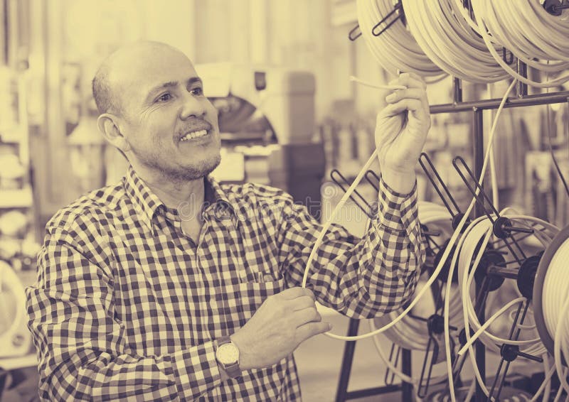 Man Choosing Cable in Household Store Stock Image - Image of caucasian ...