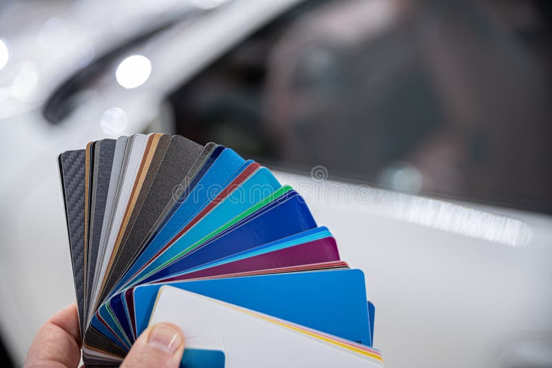 Man Choosing Color of His Car with Color Sampler. Stock Image - Image ...