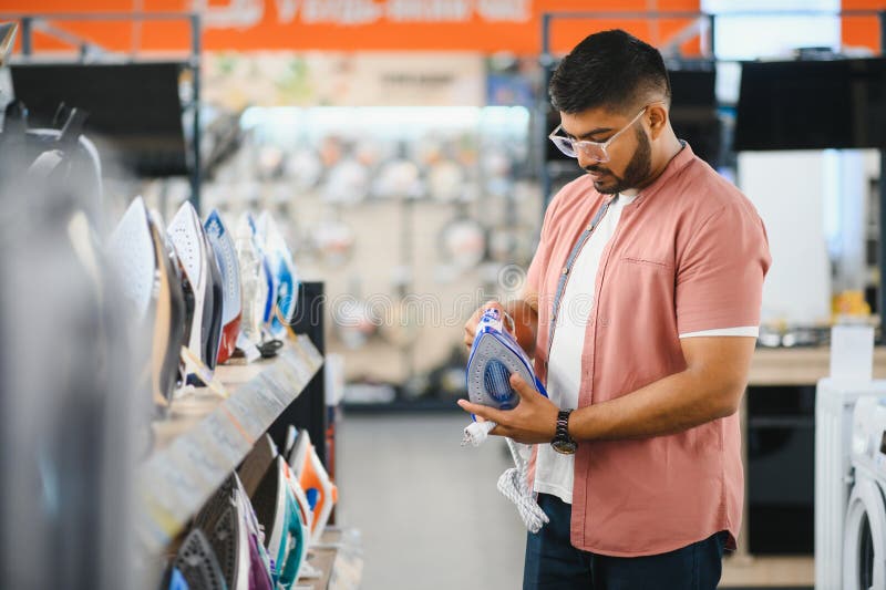 Indian Man Choosing Electric Iron at Store Stock Image - Image of ...