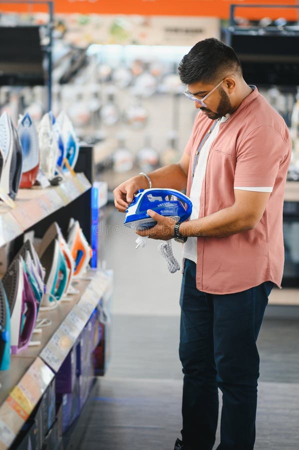 Indian Man Choosing Electric Iron at Store Stock Photo - Image of store ...