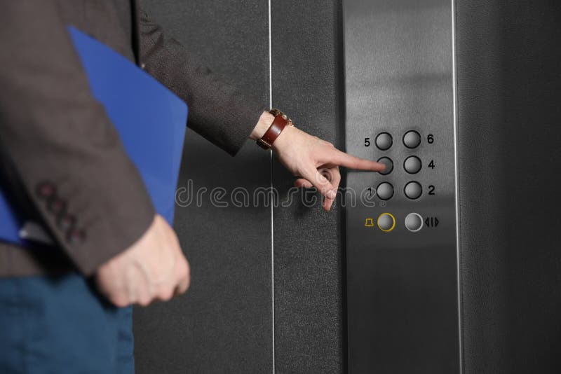 Man Choosing Floor in Elevator, Closeup View Stock Image - Image of ...