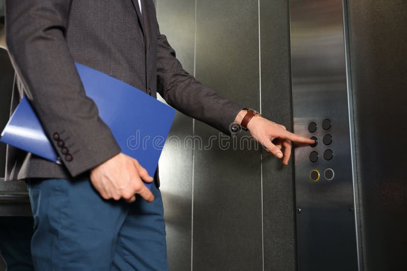 Man Choosing Floor in Elevator, Closeup View Stock Image - Image of ...