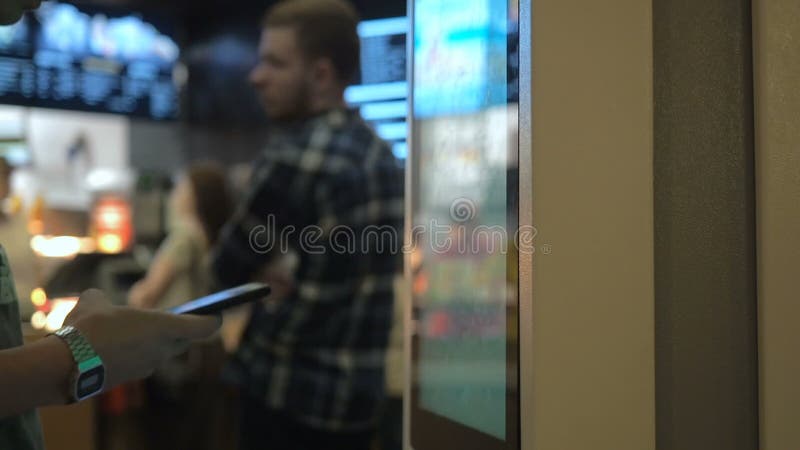 Man Choosing Food Via Self-service Machine at Fast Food Restaurant. Boy ...