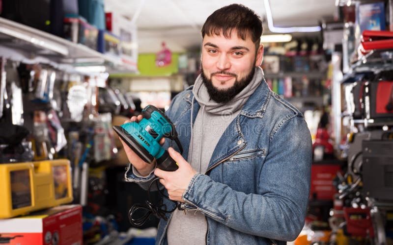 Man Choosing Grinder Machine in Store Stock Image - Image of employee ...