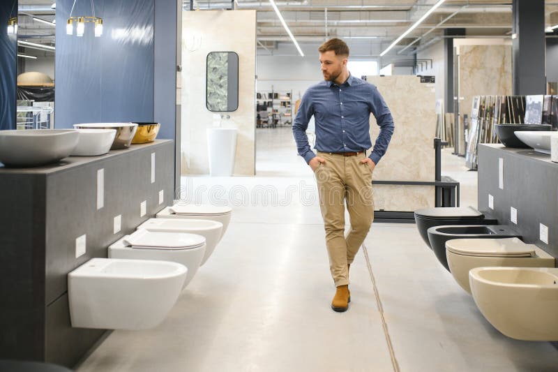Man Choosing Home Toilet in Store Stock Photo - Image of toilet, sink ...