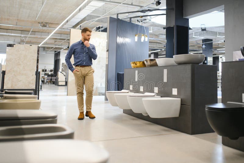 Man Choosing Home Toilet in Store Stock Photo - Image of plumbing ...