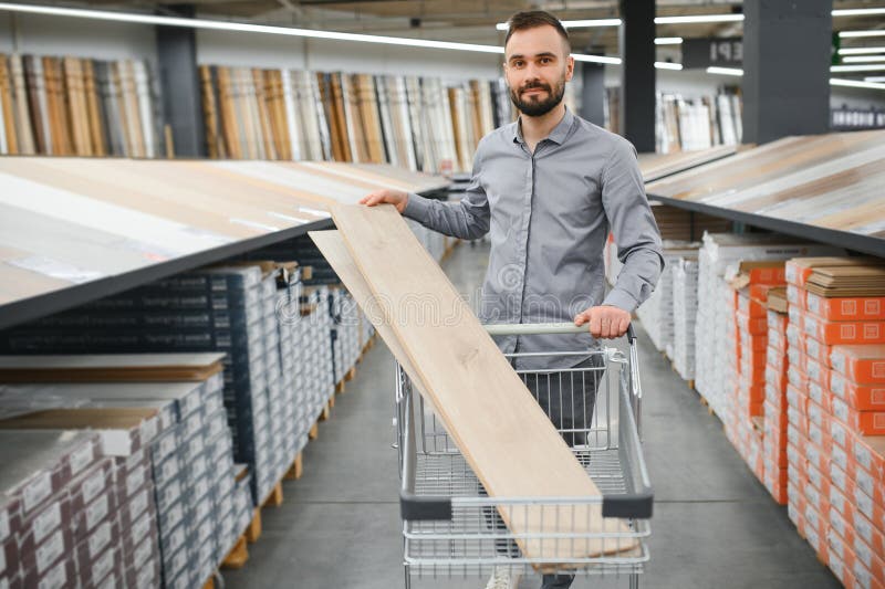 Man Choosing Laminate Samples in Hardware Store Stock Image - Image of ...