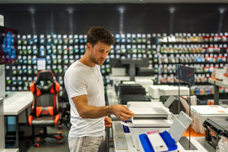 Man Choosing Printer in Store Stock Photo - Image of serious, commerce ...