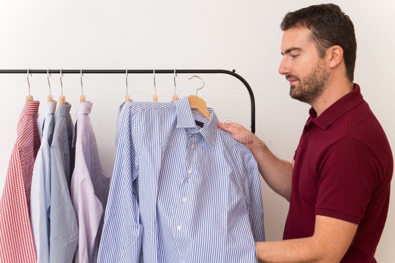 Man Choosing Shirts in Several Colors and Textures Stock Photo - Image ...