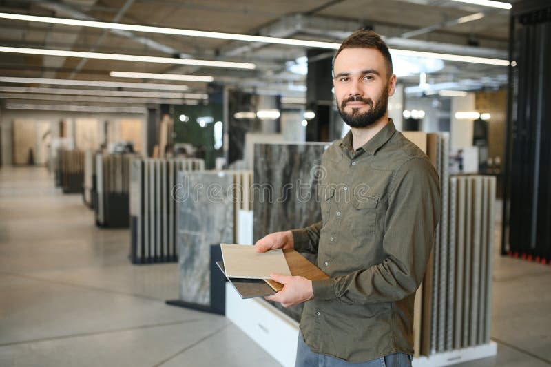 Man Choosing Tile among Different Samples in Store Stock Photo - Image ...
