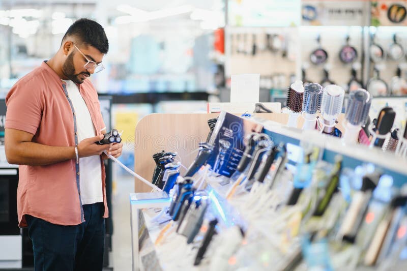 Indian Man Choosing Trimmer at Electric Store Stock Image - Image of ...