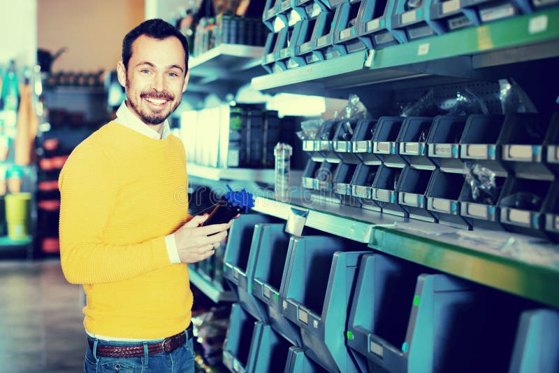 Man Choosing Various Tools in Garden Equipment Shop Stock Image - Image ...