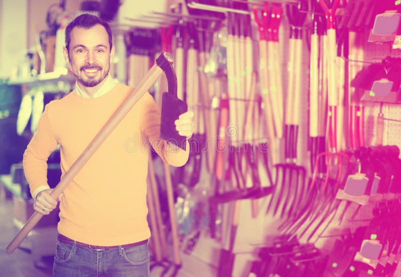 Man Choosing Various Tools in Garden Equipment Shop Stock Image - Image ...